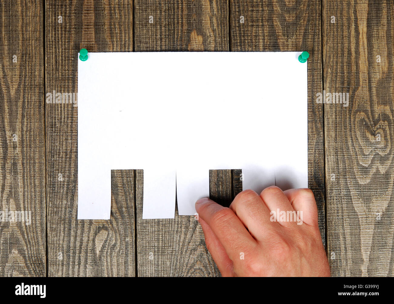 Ads poster pinned on a dark fence green buttons Stock Photo - Alamy