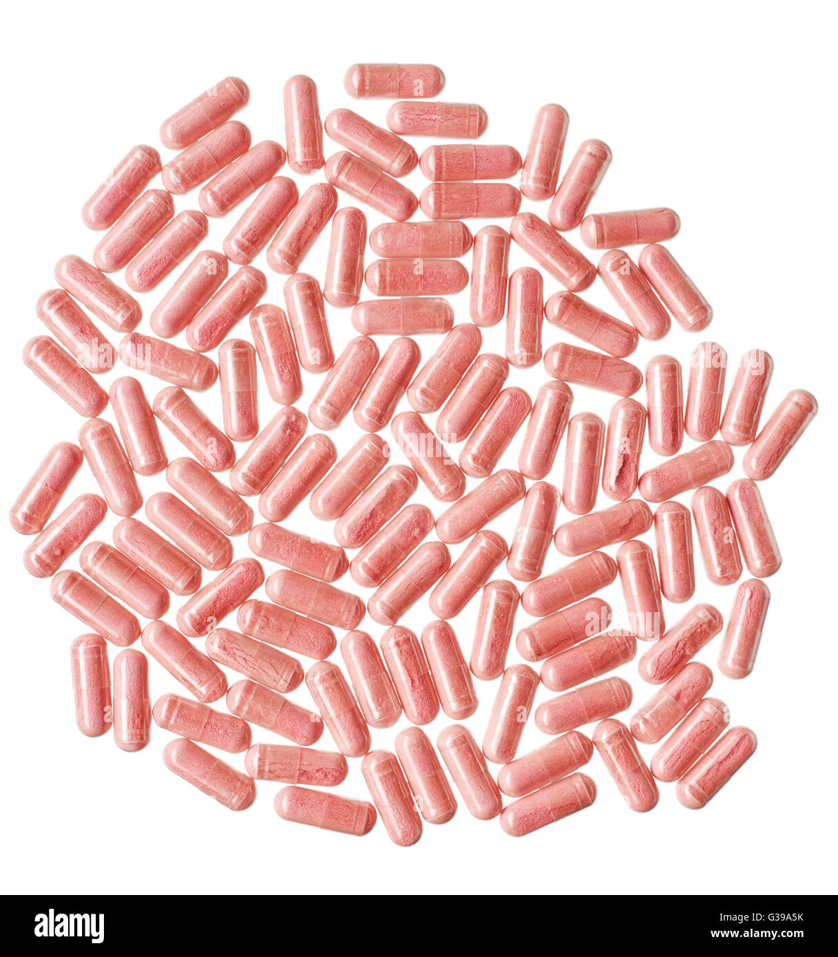 Pile of pink capsules isolated on white background Stock Photo - Alamy