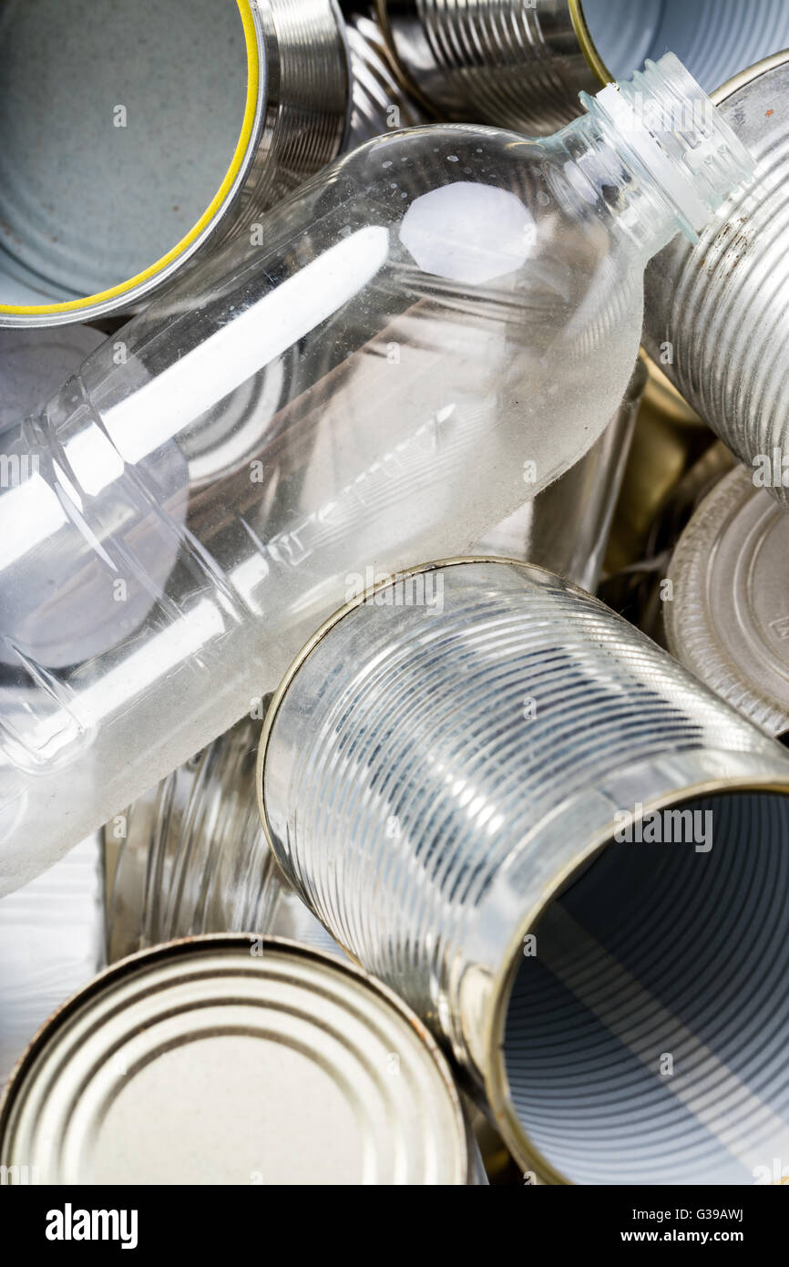 plastic transparent used bottle in the middle of trash with glass and ...