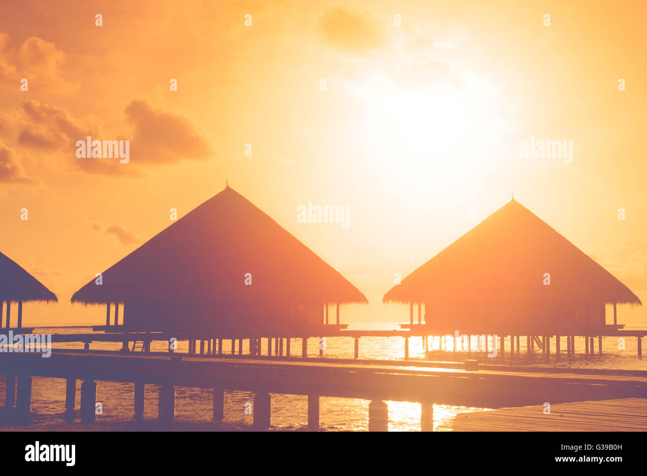 Sunset on Maldives island Stock Photo - Alamy
