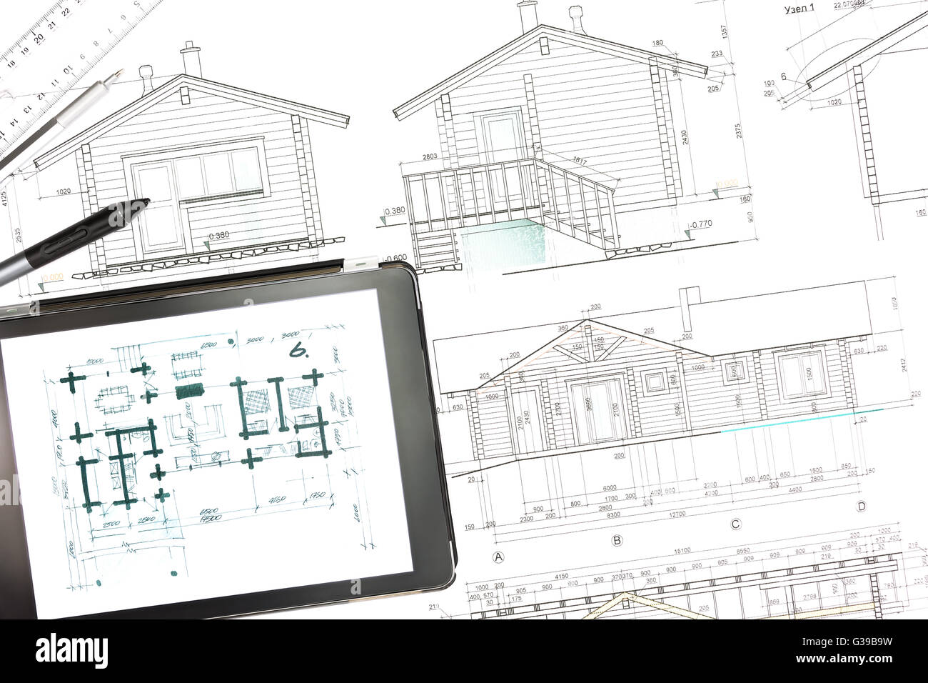 architectural project of new house and tablet computer with sketch ...