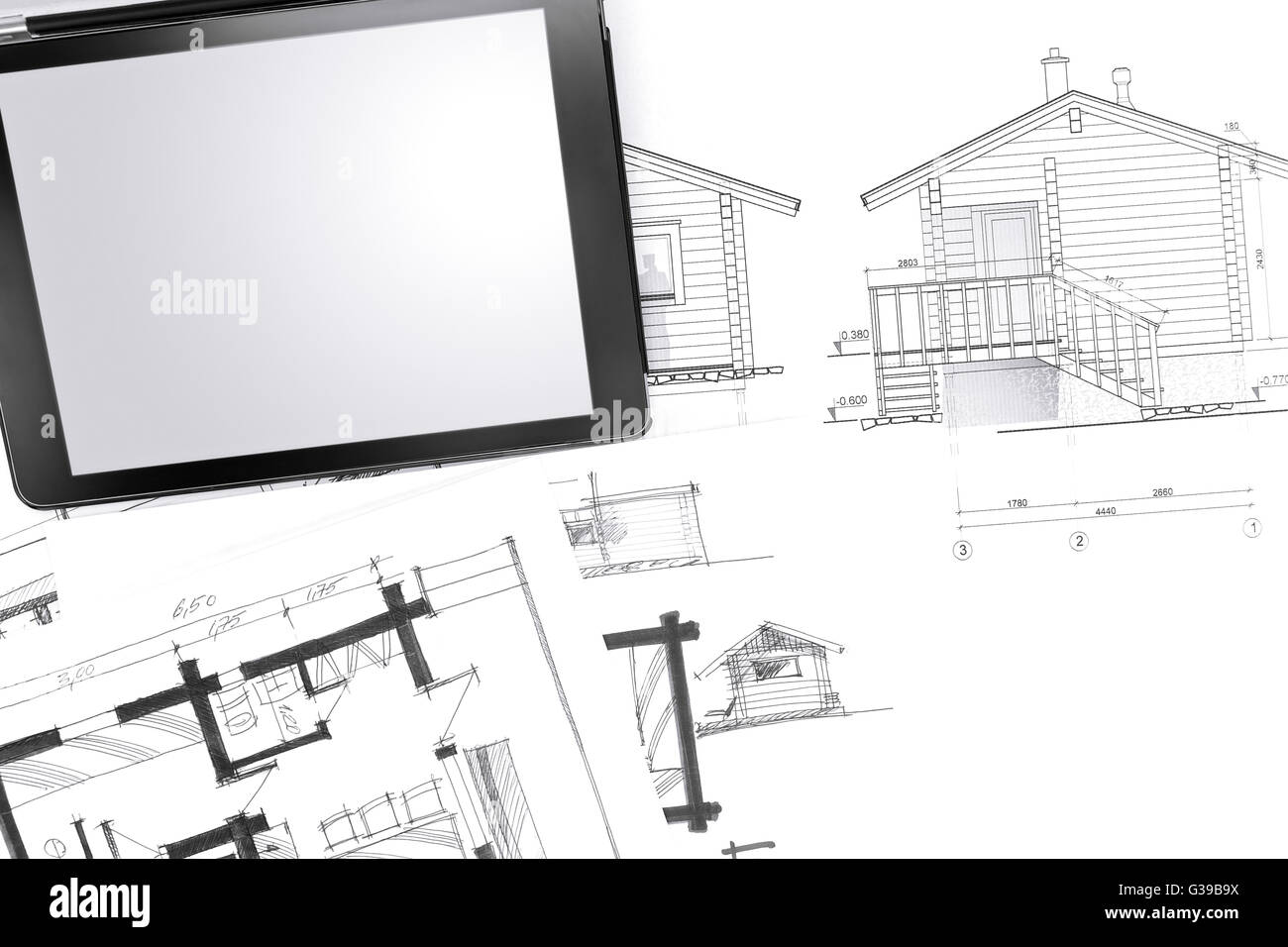 tablet computer with sketch and home plan blueprint Stock Photo - Alamy