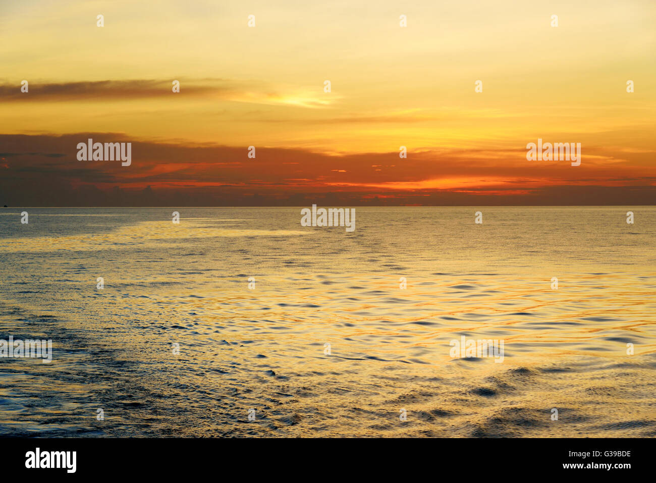 Beautiful sunset at the equator. View from ferry Stock Photo - Alamy