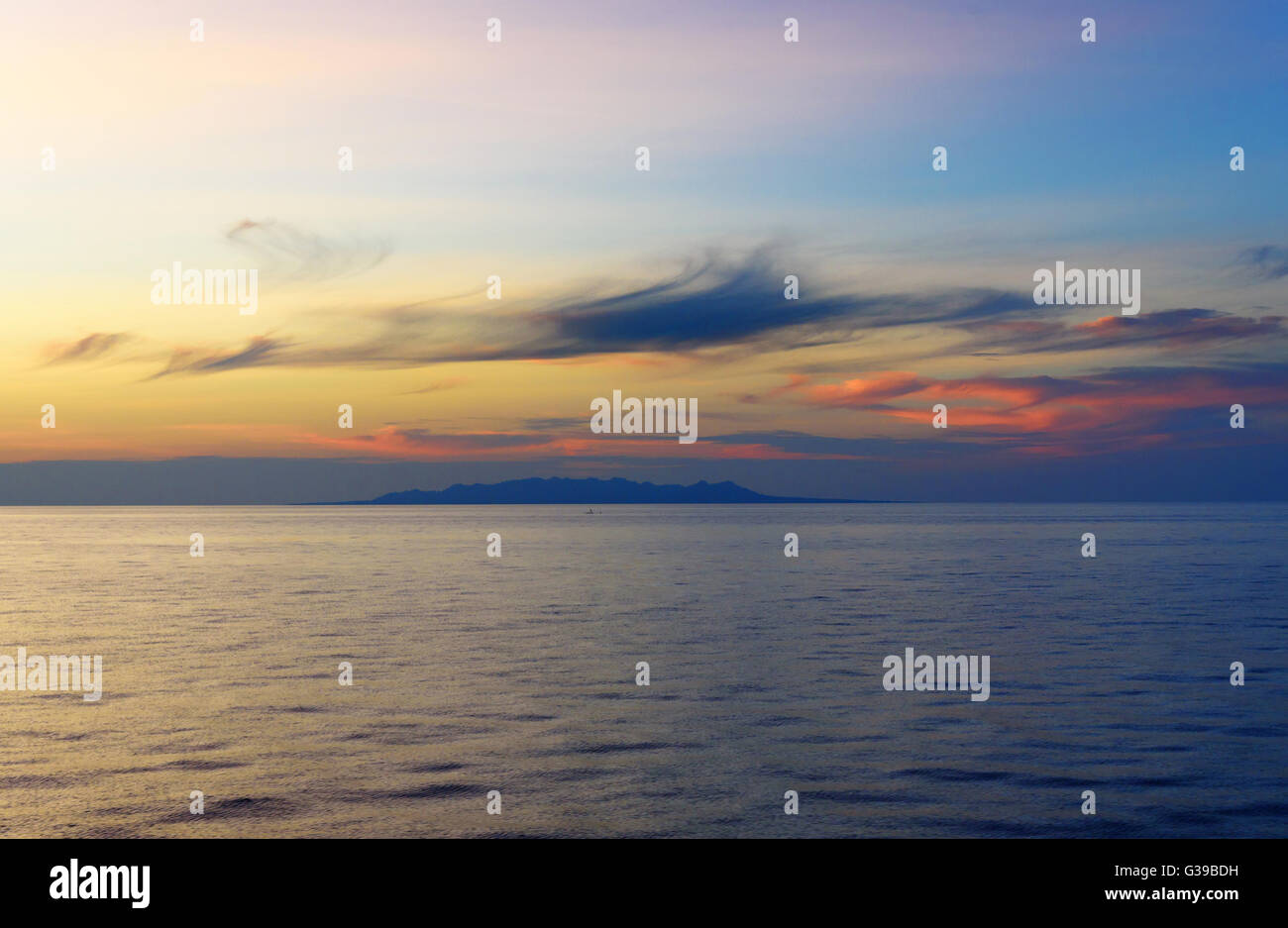 Beautiful sunset at the equator. View from ferry Stock Photo - Alamy