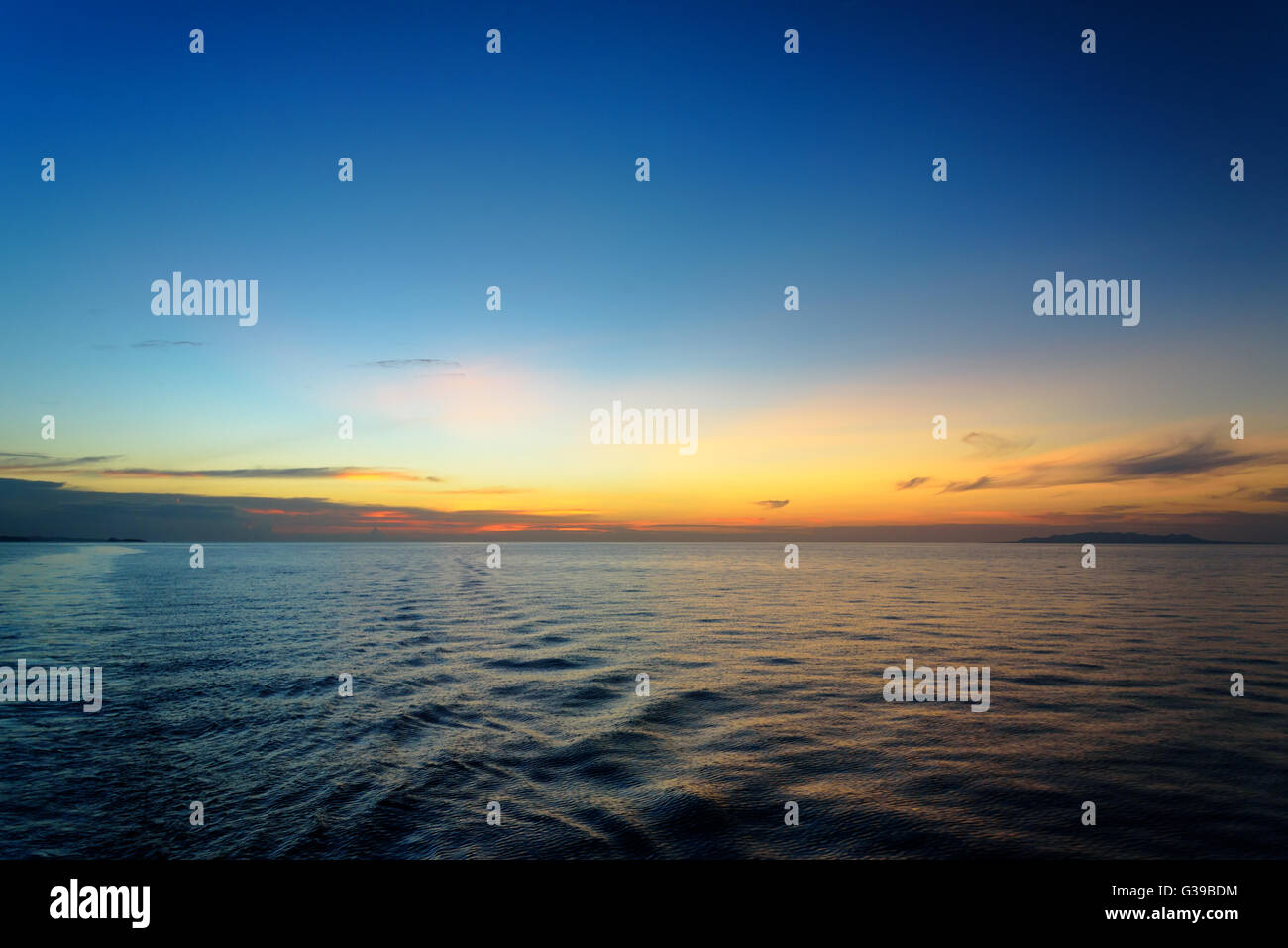 Beautiful sunset at the equator. View from ferry Stock Photo - Alamy