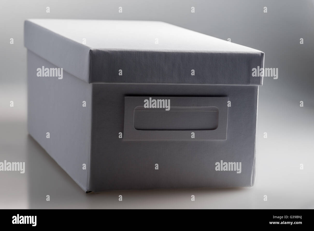 Cardboard box in the shade on a white background Stock Photo - Alamy