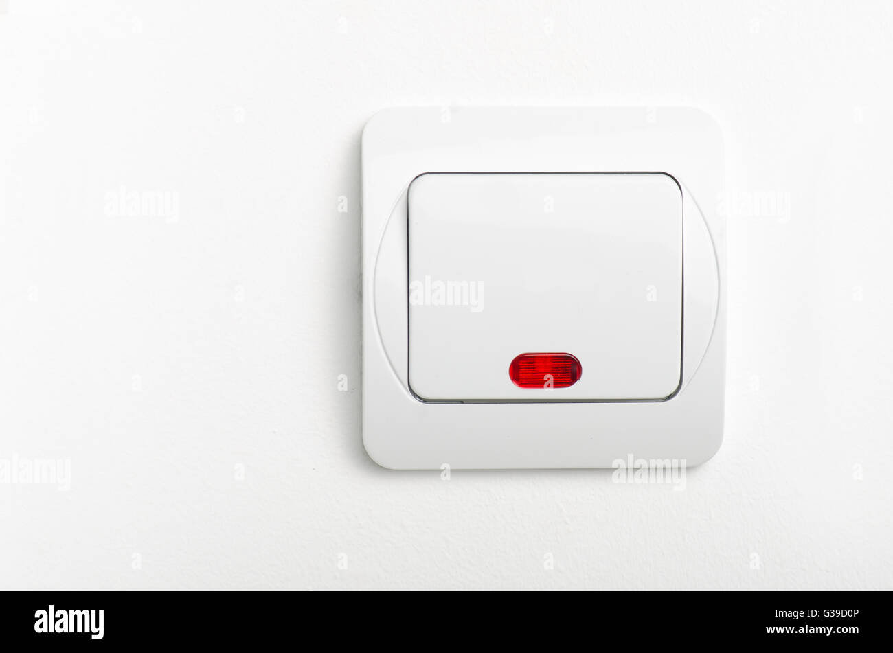 Light switch with red led on white wall Stock Photo - Alamy