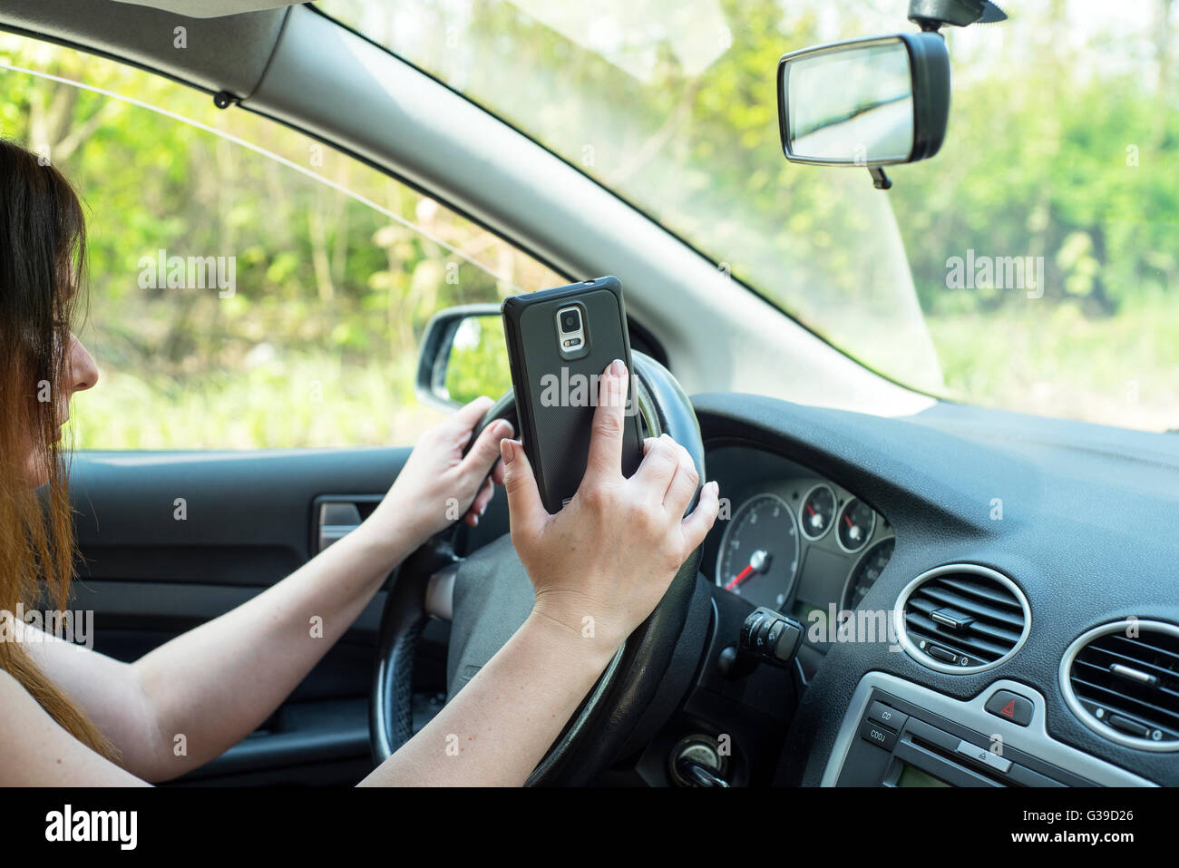 image depicting a woman riding in a car and talking on the phone Stock ...