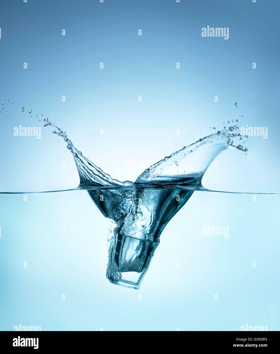 glass falling and splashing into water Stock Photo - Alamy