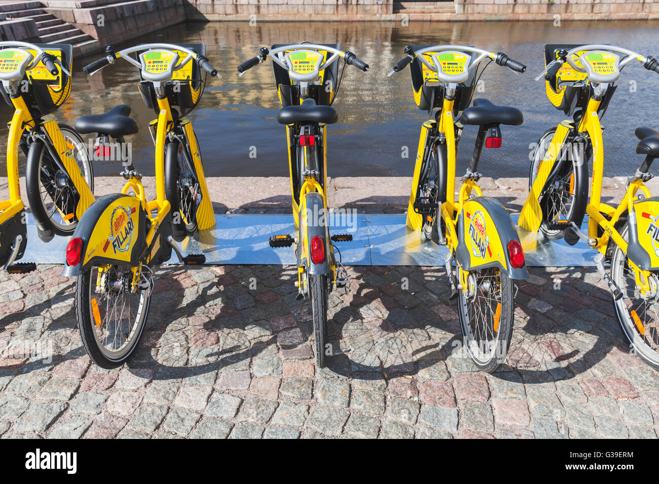 Helsinki, Finland - May 21, 2016: Yellow city bicycles for rent stand ...