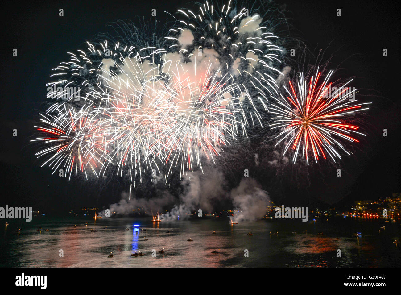Brightly colorful fireworks in the night sky Stock Photo - Alamy