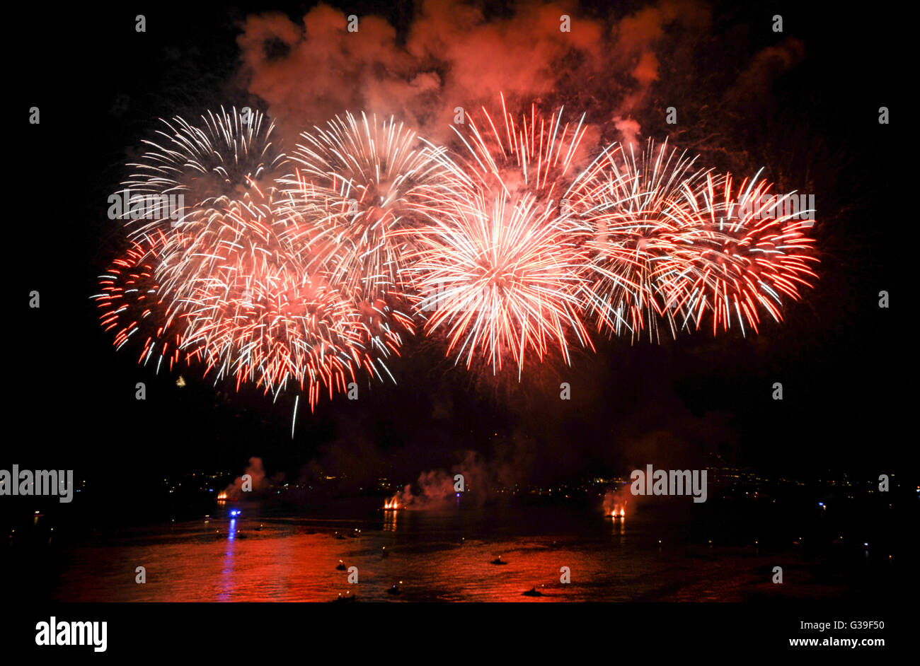 Brightly colorful fireworks in the night sky Stock Photo - Alamy