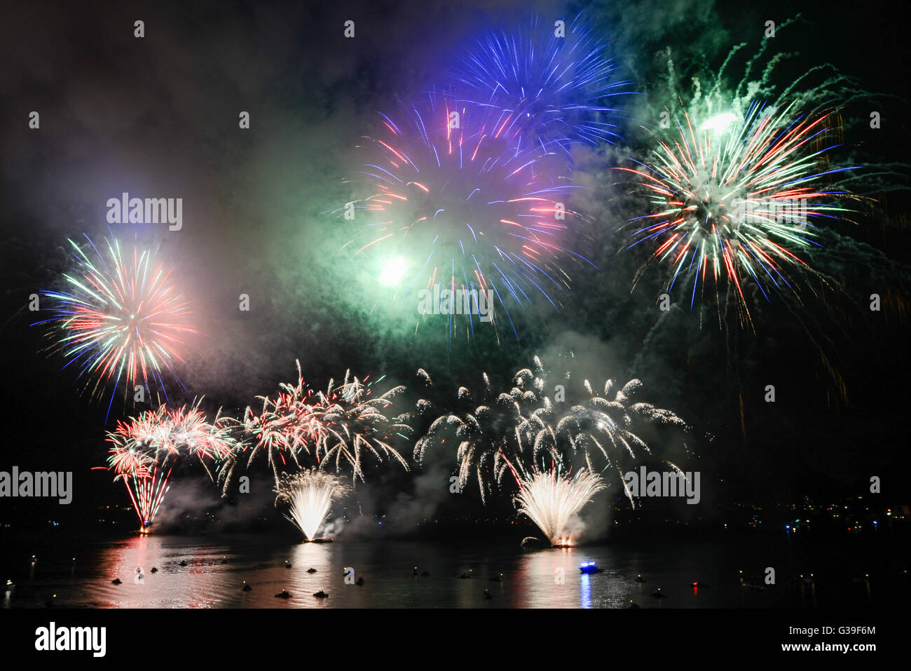 Brightly colorful fireworks in the night sky Stock Photo - Alamy