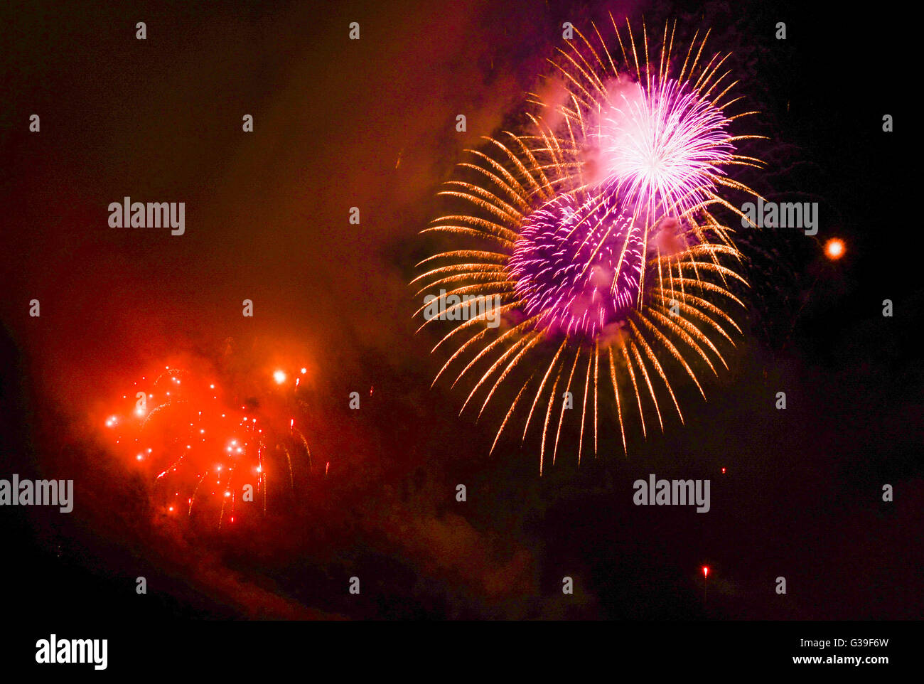Brightly colorful fireworks in the night sky Stock Photo - Alamy