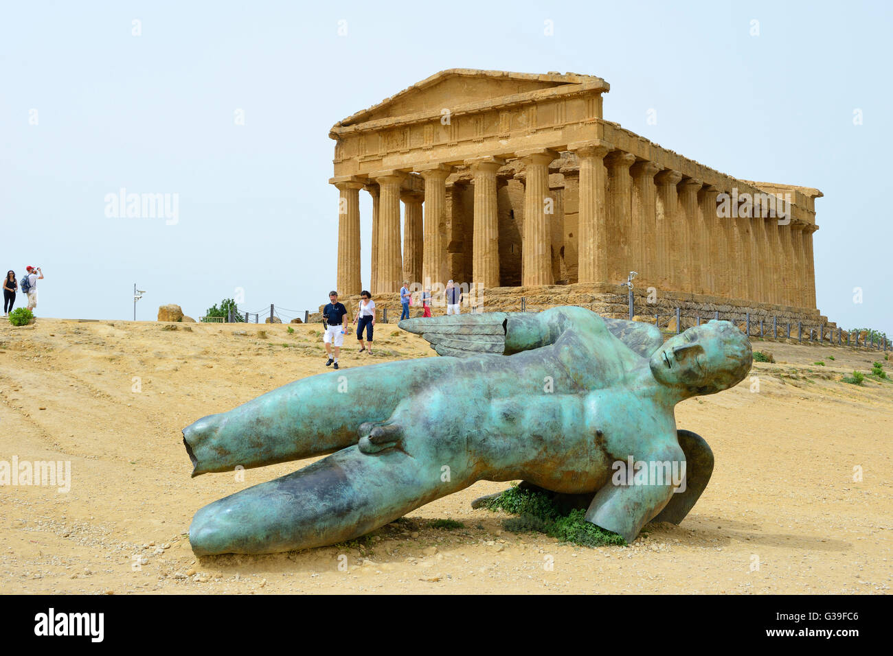 Bronze sculpture of Fallen Icarus in front of Temple of Concordia in ...