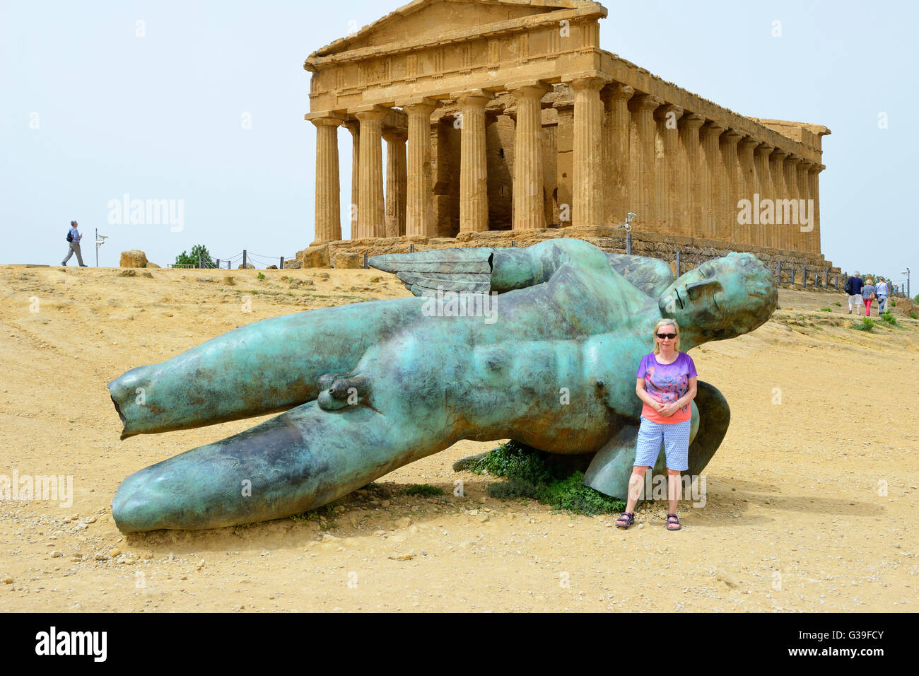 Bronze sculpture of Fallen Icarus in front of Temple of Concordia in ...
