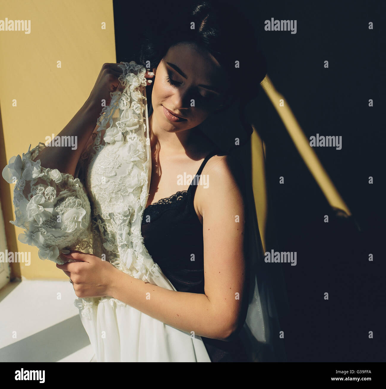Beautiful young woman bride holds hi-res stock photography and images ...