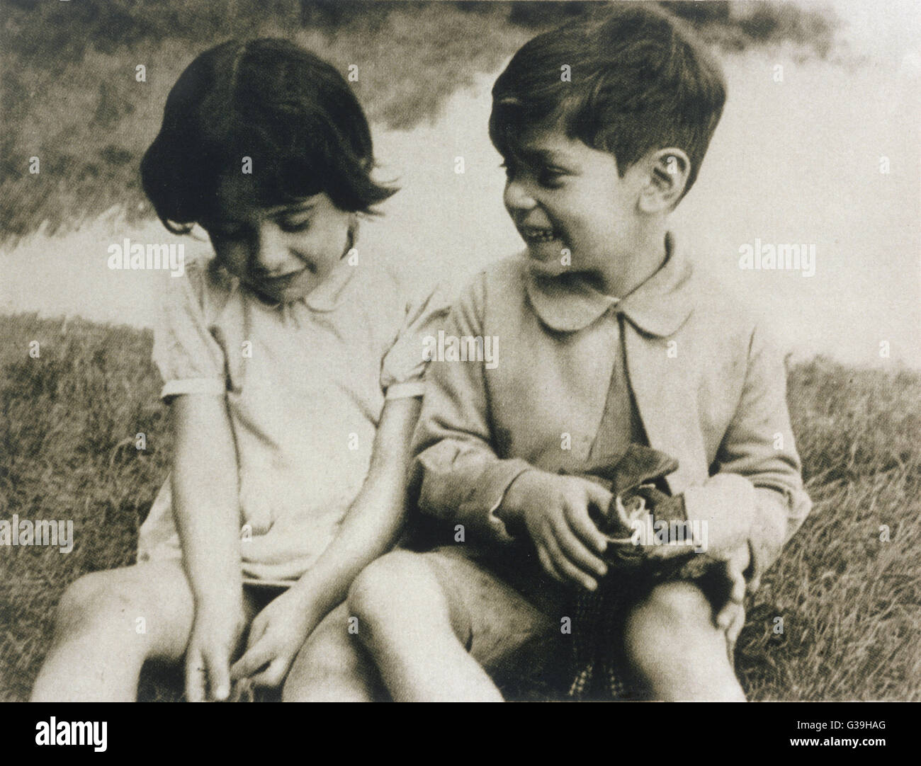 Two young Jewish children sit together in Germany during the early ...