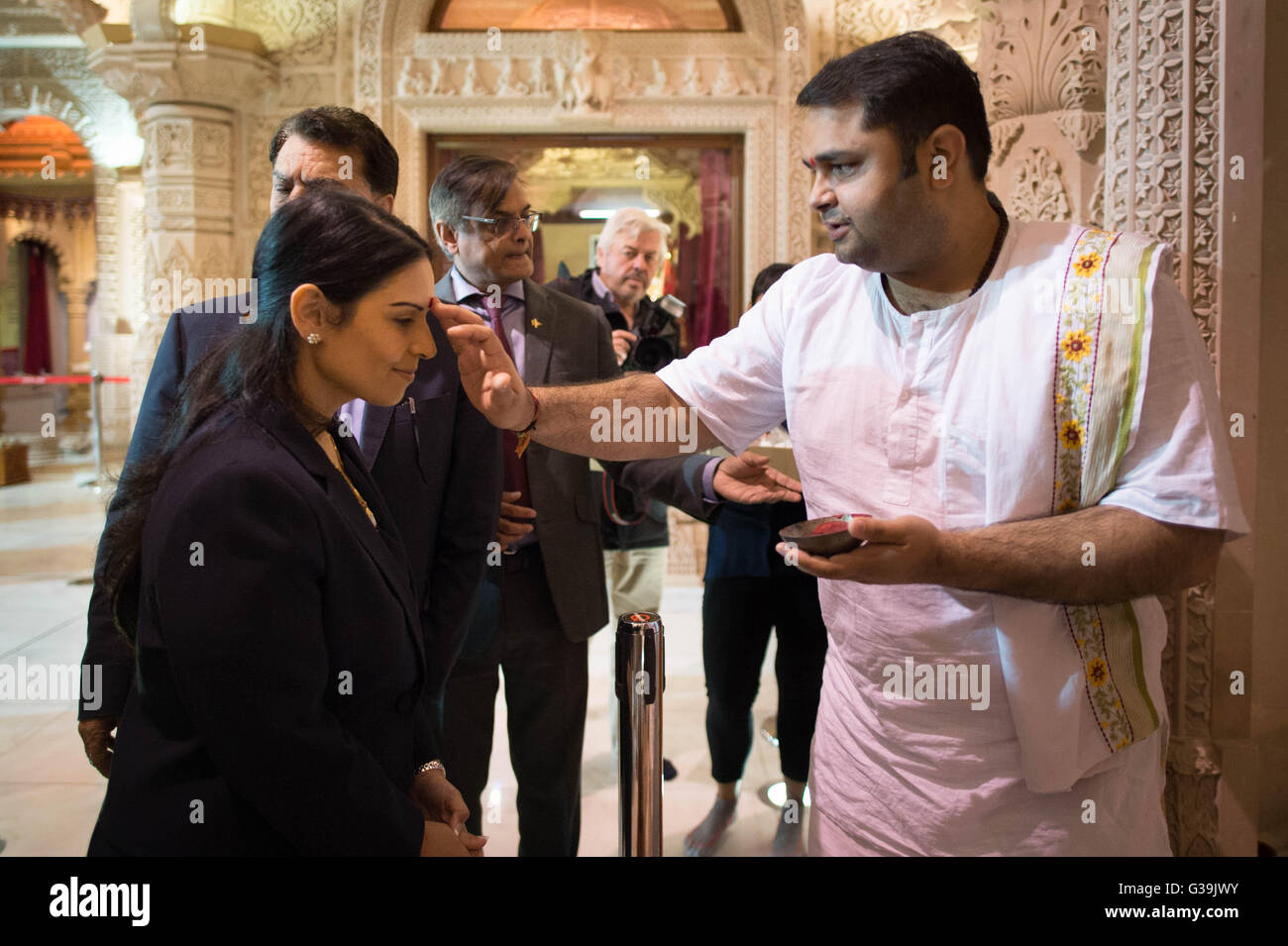 Priti Patel MP is given a tilak during a visit to Shree Sanatan Hindu ...