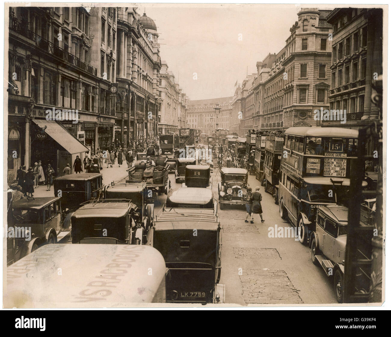 The hustle and bustle of 1930s central London, with traffic at a ...