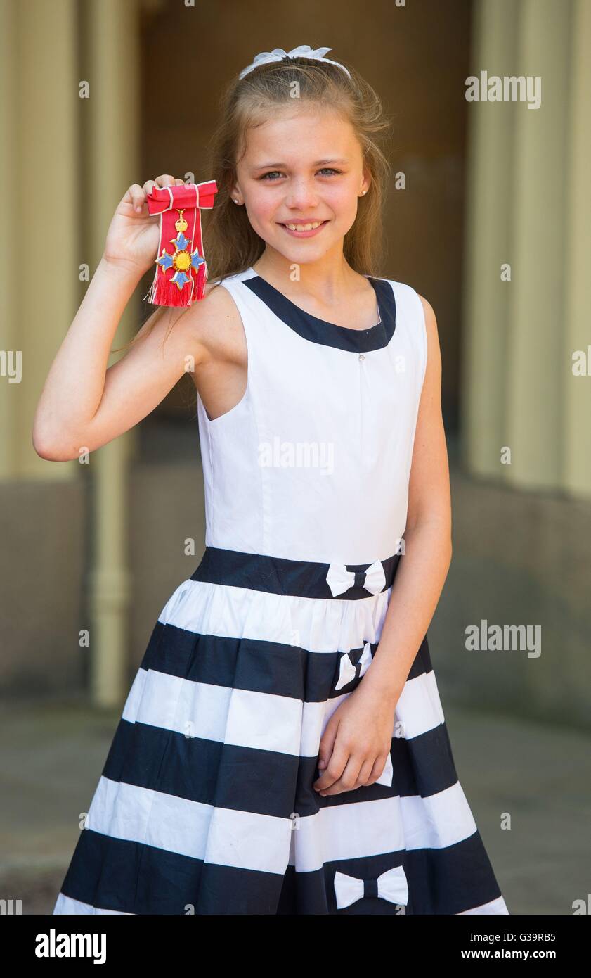 Gabriella Rummery, 10, with her grandmother Jill Tookey's CBE medal for ...