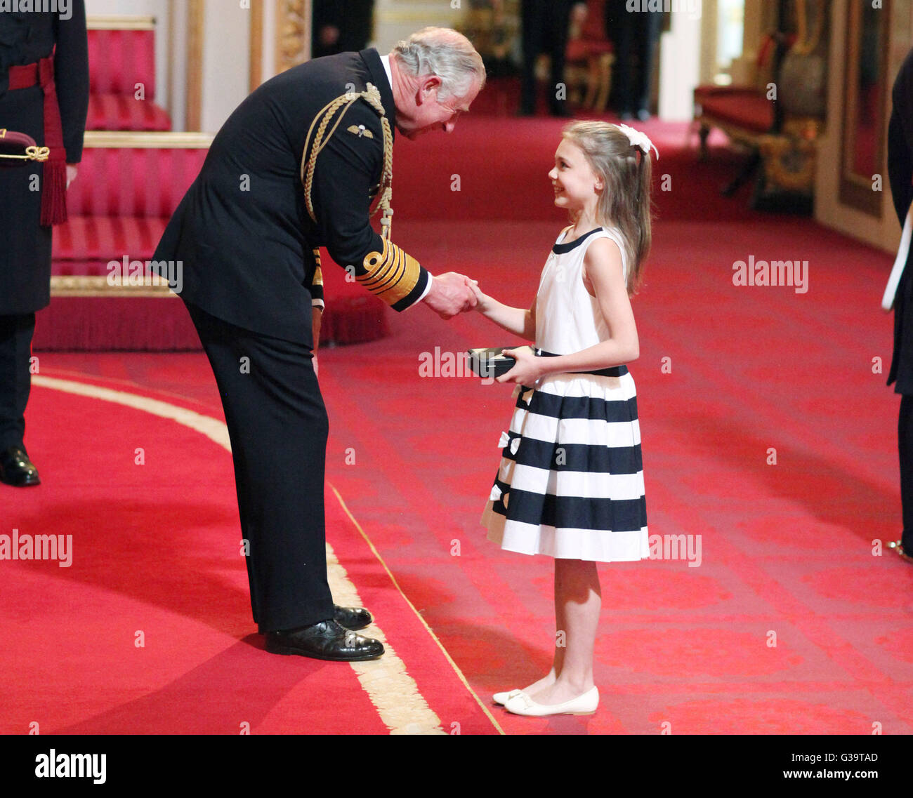 Gabriella Rummery, 10, from Kent, picks up a CBE (Commander of the ...