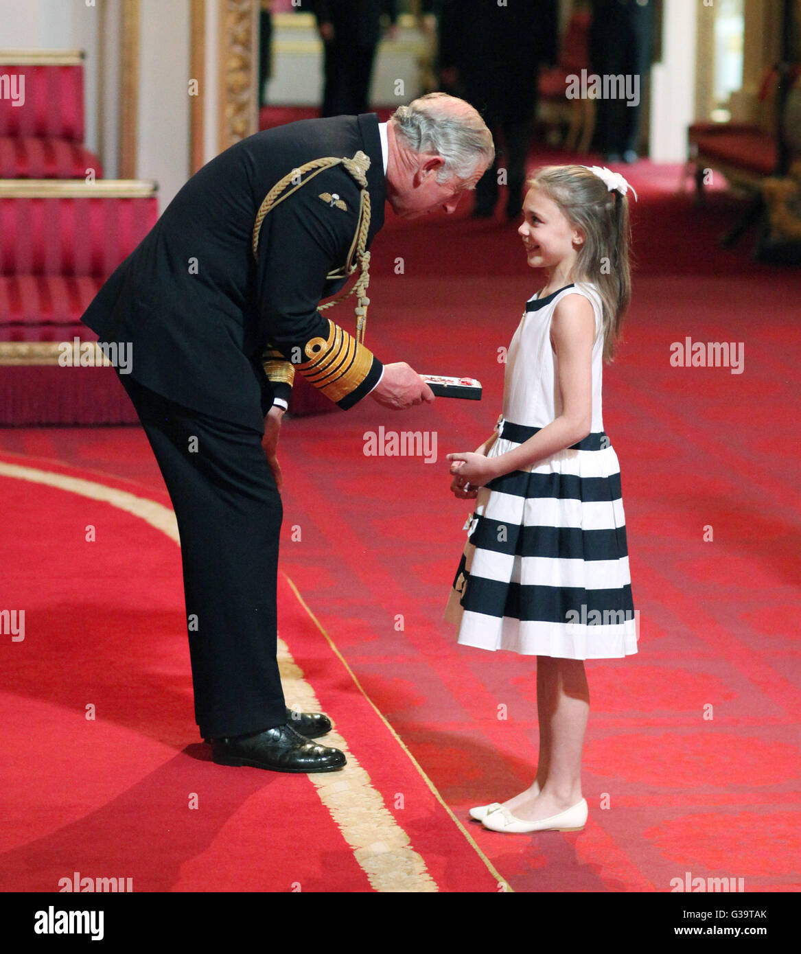 Gabriella Rummery, 10, from Kent, picks up a CBE (Commander of the ...