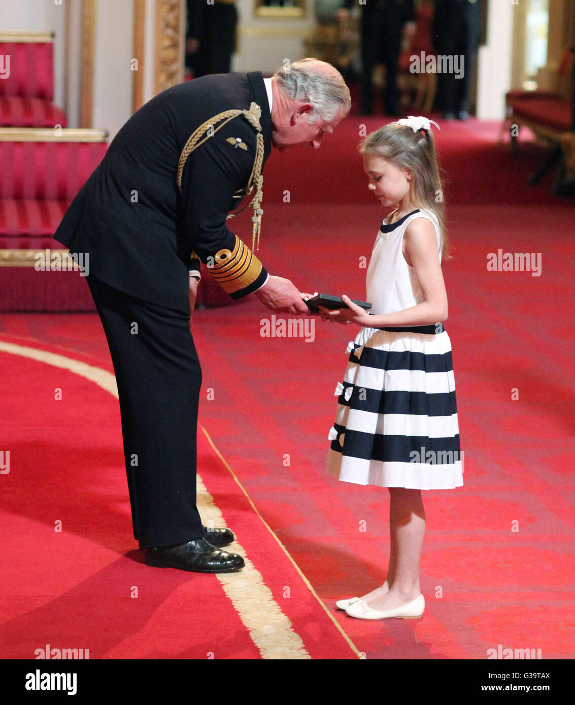 Gabriella Rummery, 10, from Kent, picks up a CBE (Commander of the ...