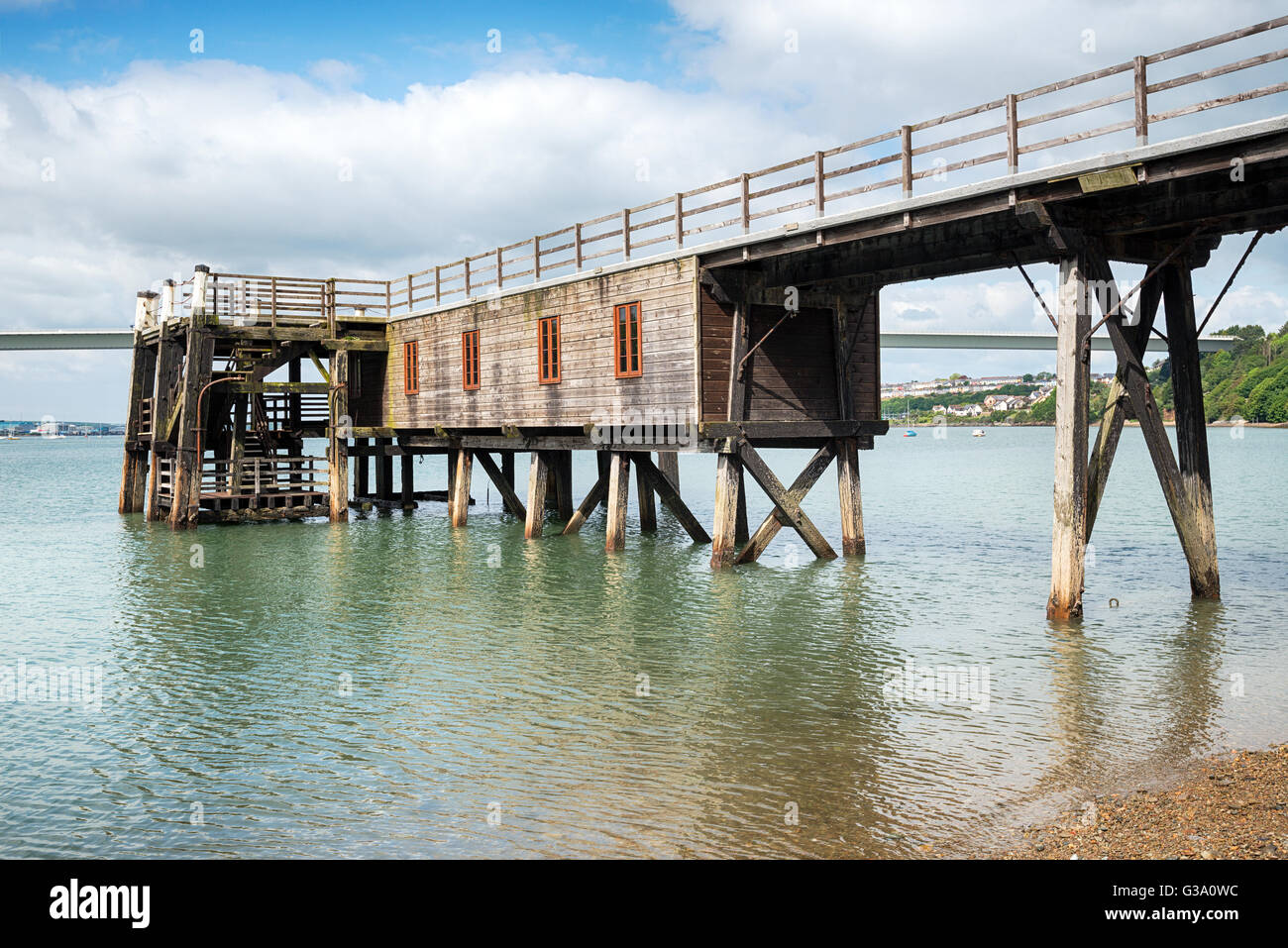 A wooden jetty on the banks of the Cleddau River at Burton Ferry in ...