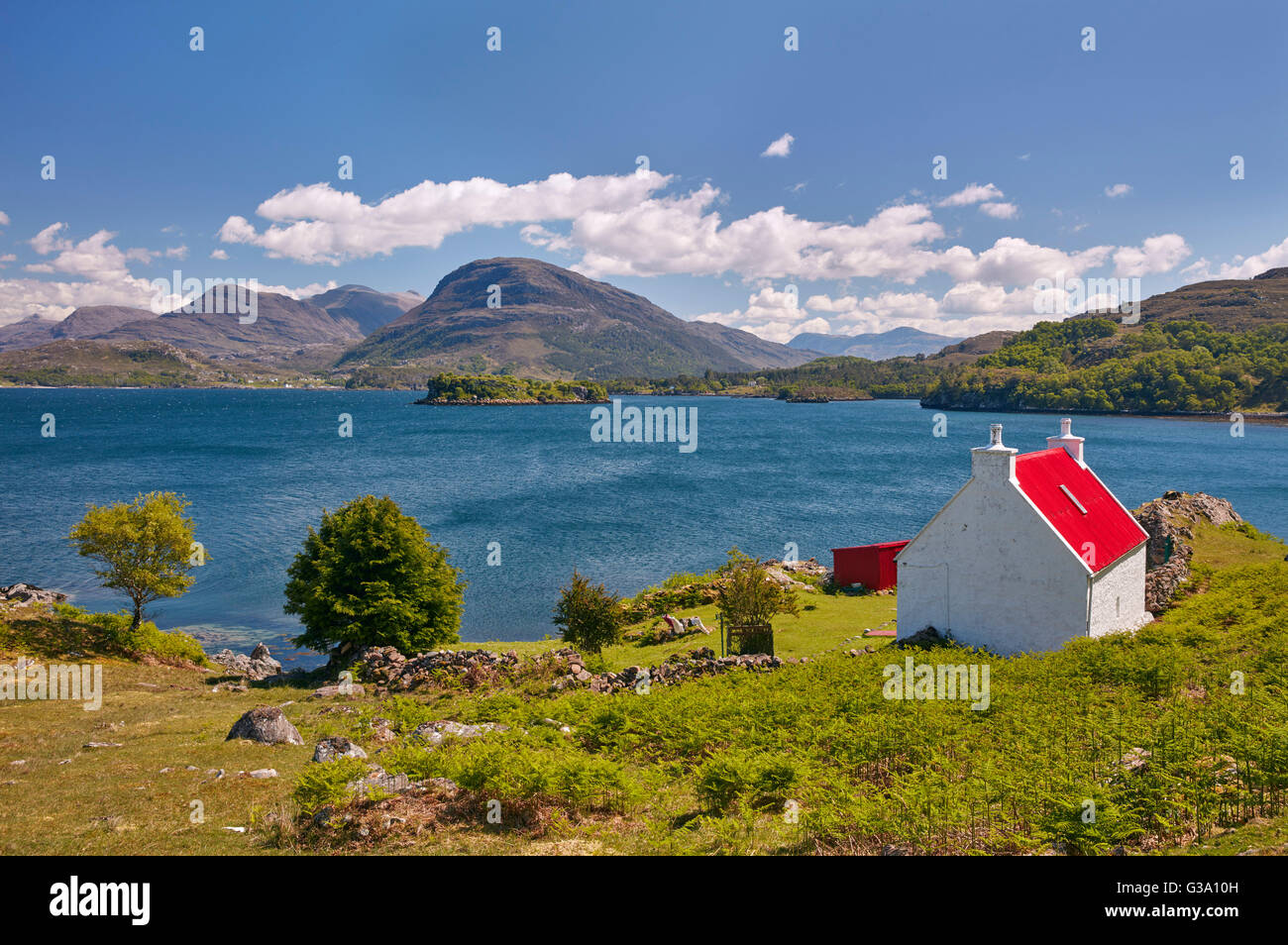 Cottage on coast above Loch Shieldaig. Applecross Peninsula, Ross and ...