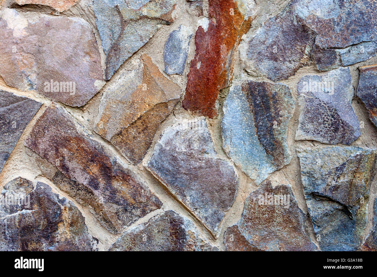 irregular texture of the old yellow stone wall outside Stock Photo - Alamy