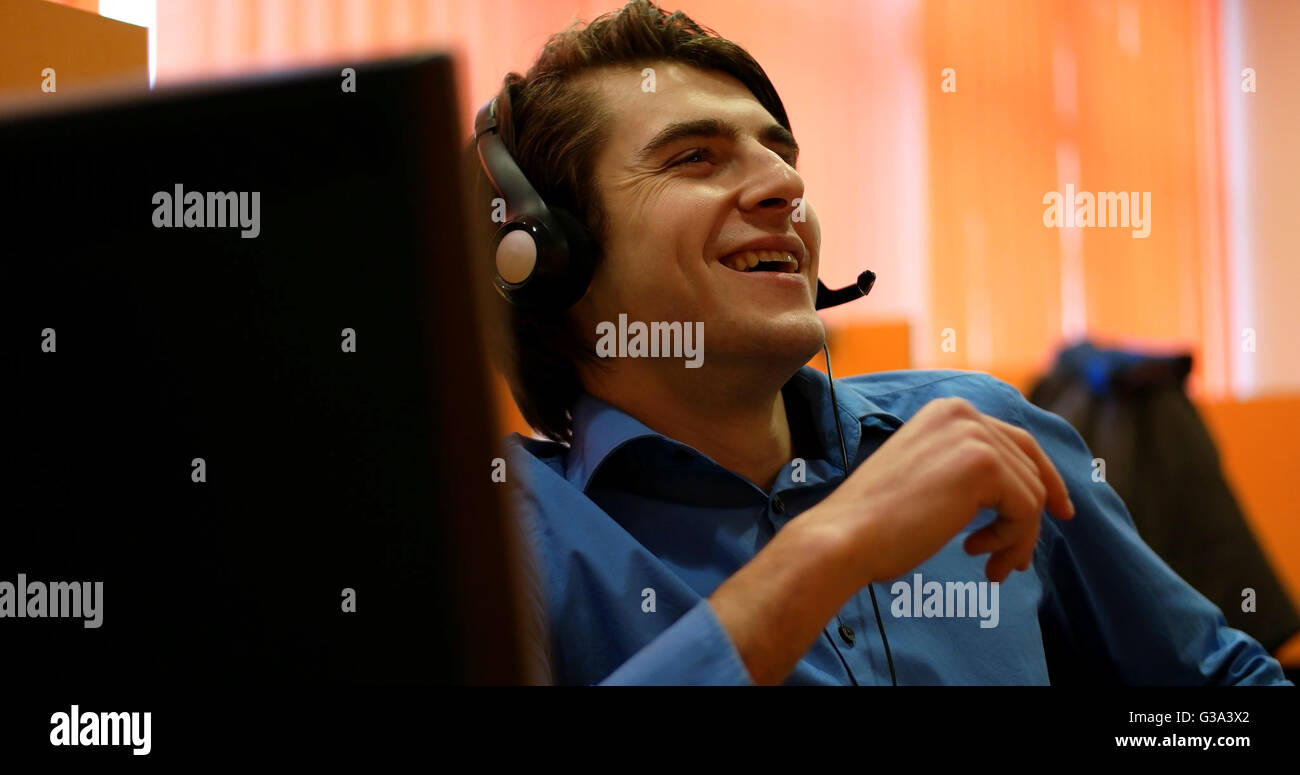 Portrait of confident male customer service representative with headset ...
