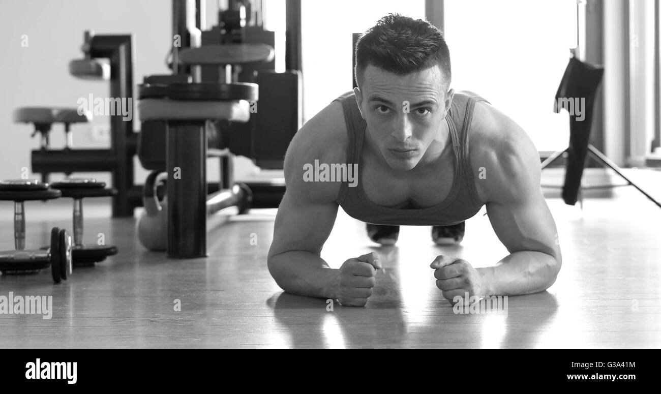 Portrait of a handsome man doing push ups exercise Stock Photo - Alamy