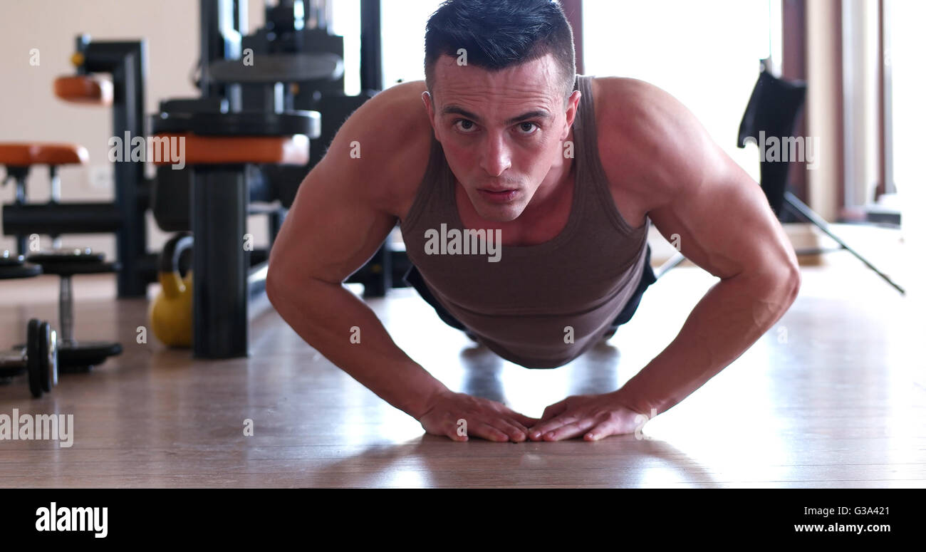 Portrait of a handsome man doing push ups exercise Stock Photo - Alamy