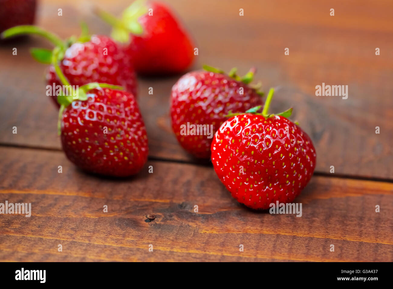 Very beautiful background with fresh strawberries in a wicker round ...