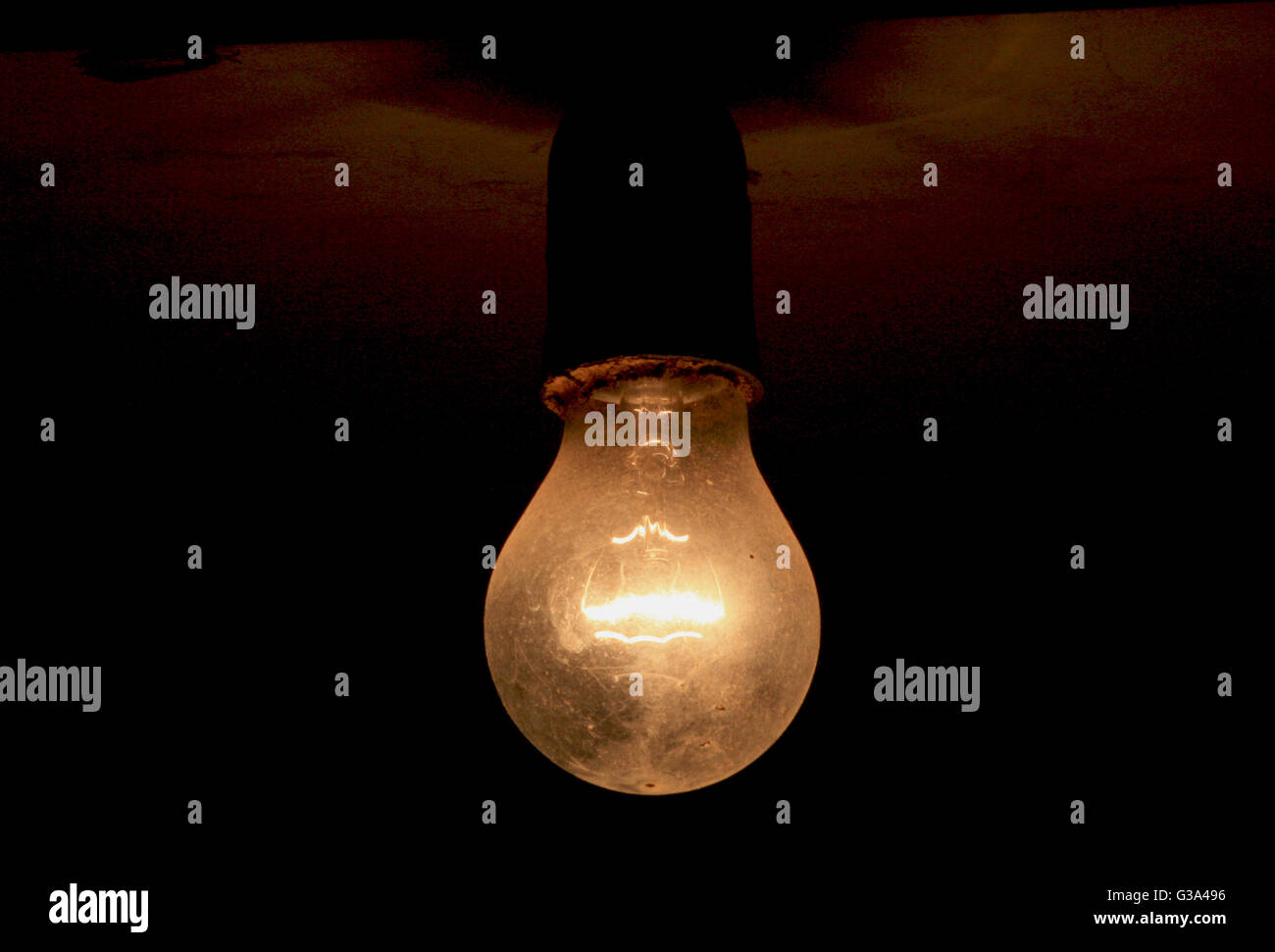 Old dusty bulb illuminated Stock Photo - Alamy