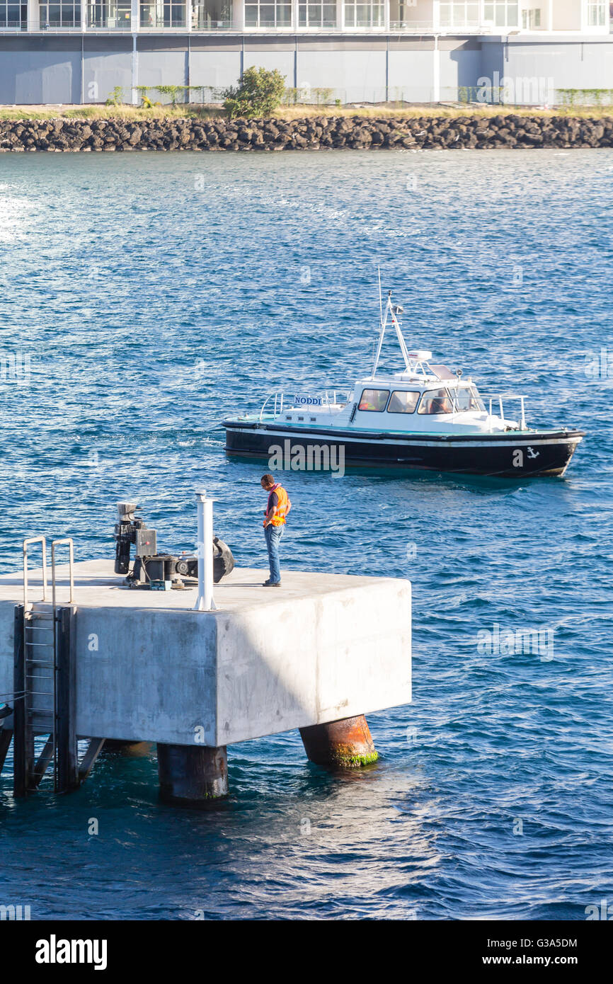 Harbor Worker on Mooring Platform in Martinique Stock Photo - Alamy