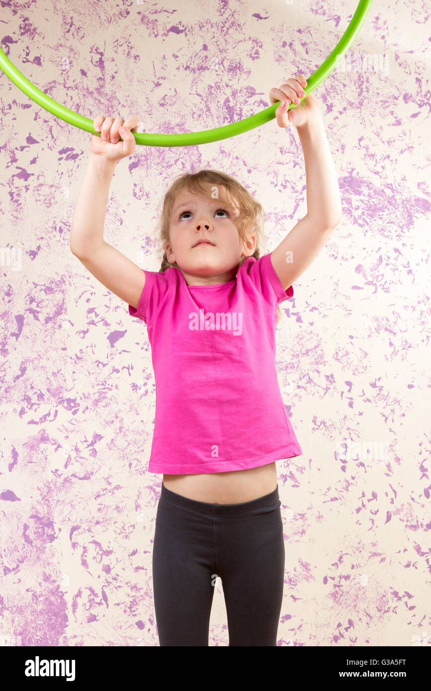 cute little girl with a huls hoop Stock Photo - Alamy