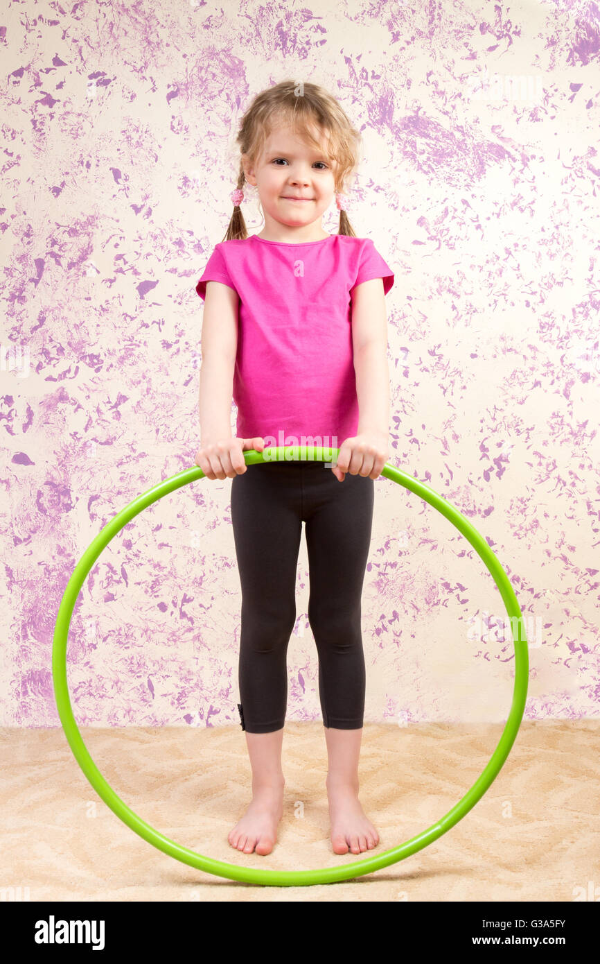 cute little girl with a huls hoop Stock Photo - Alamy