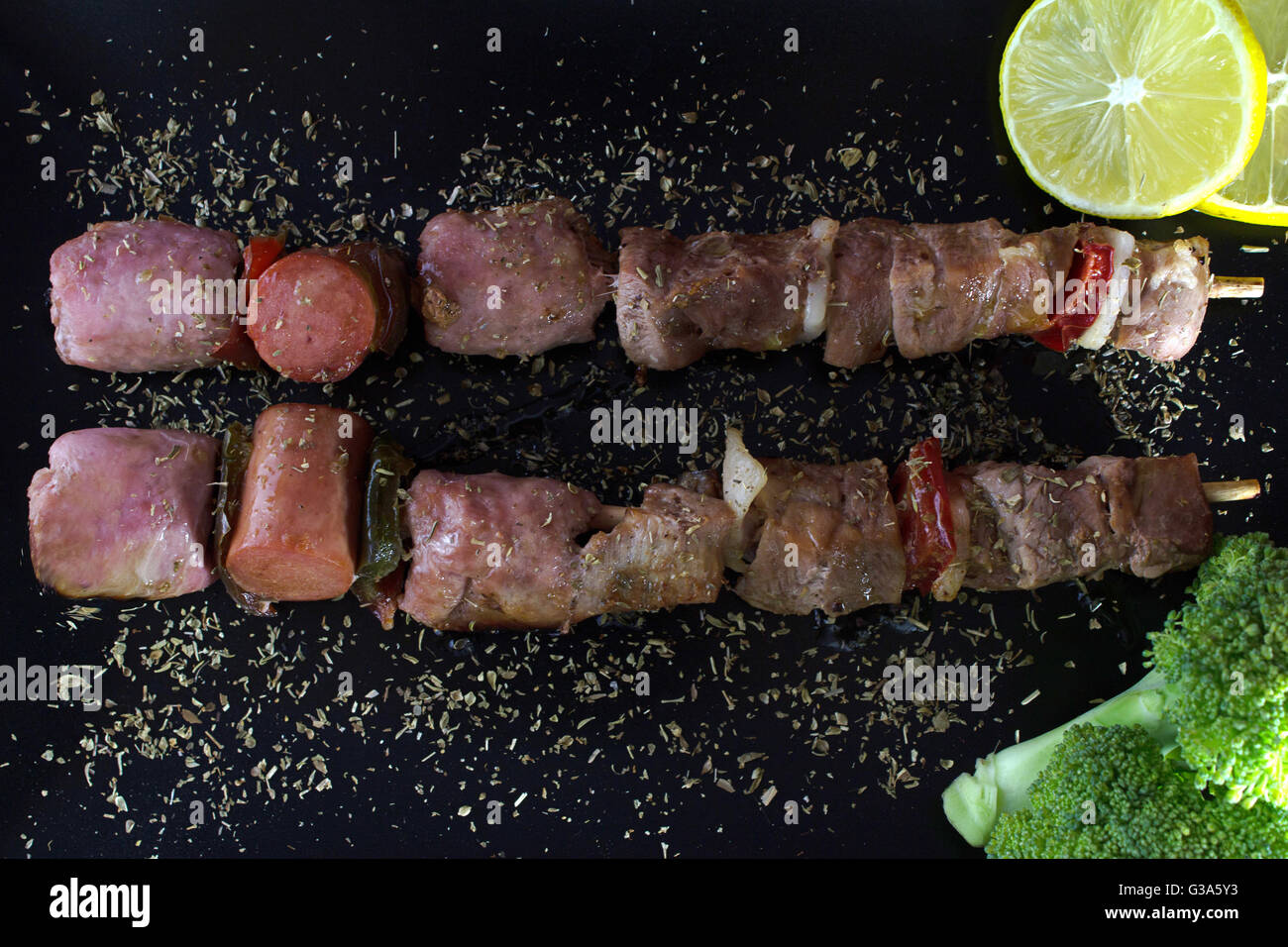 Tasty grilled brochette with beef and pork meat, with vegetables, as ...