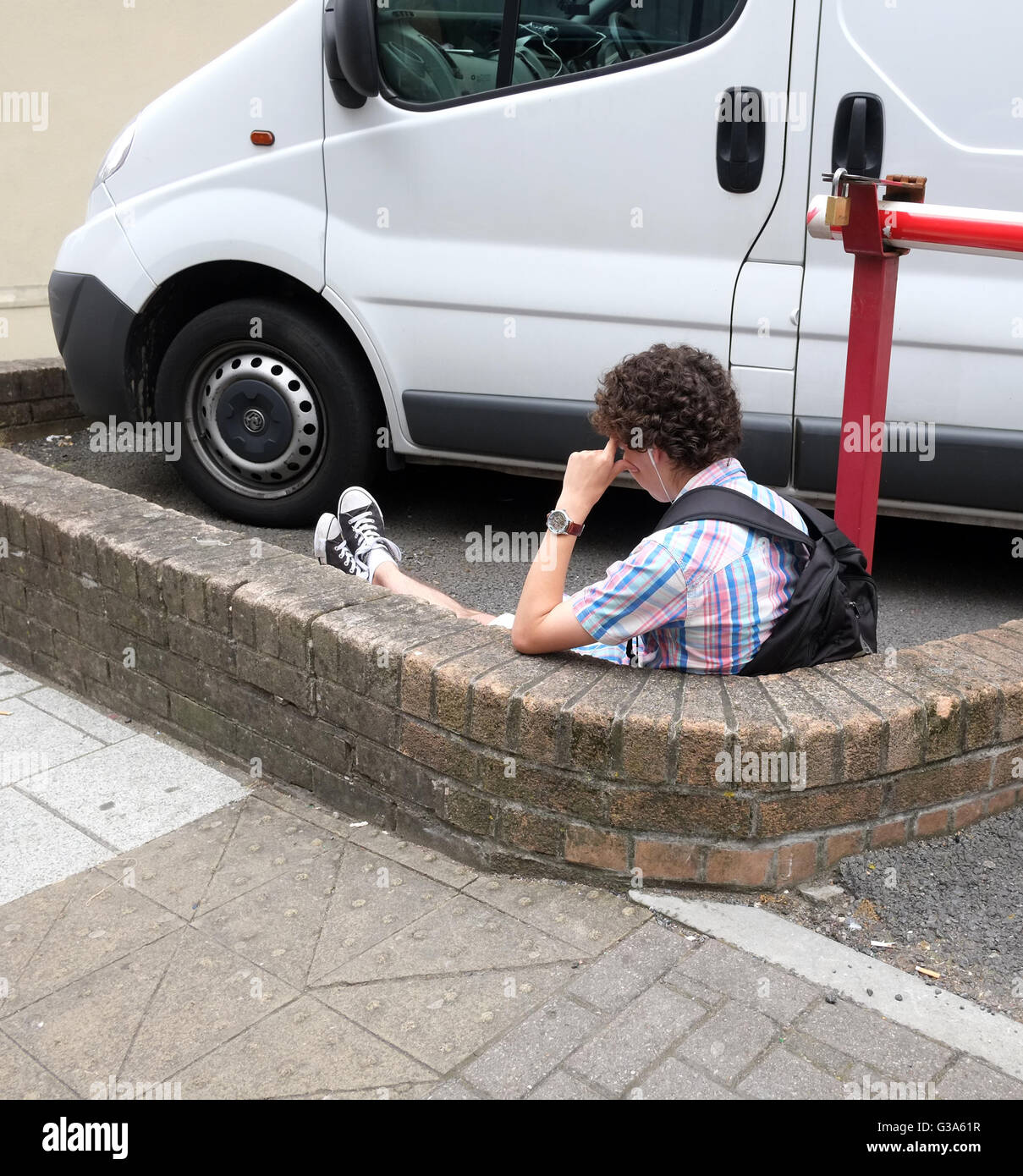 Male student reading book hi-res stock photography and images - Alamy