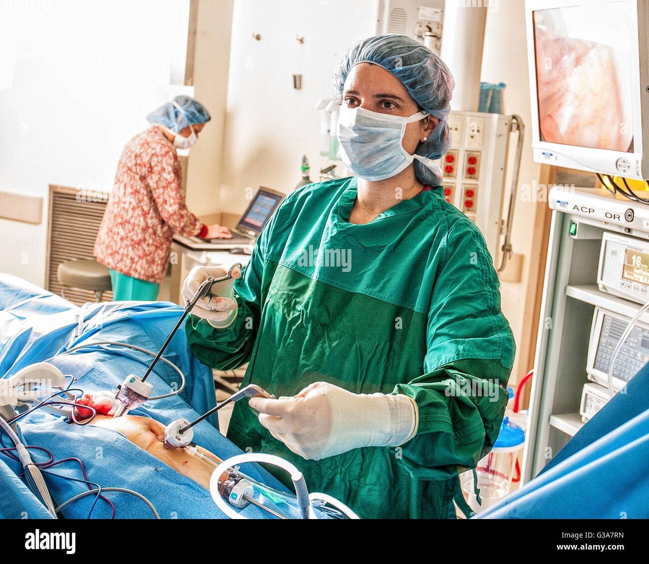 Surgeon performs minimally invasive laparoscopic abdominal surgery ...