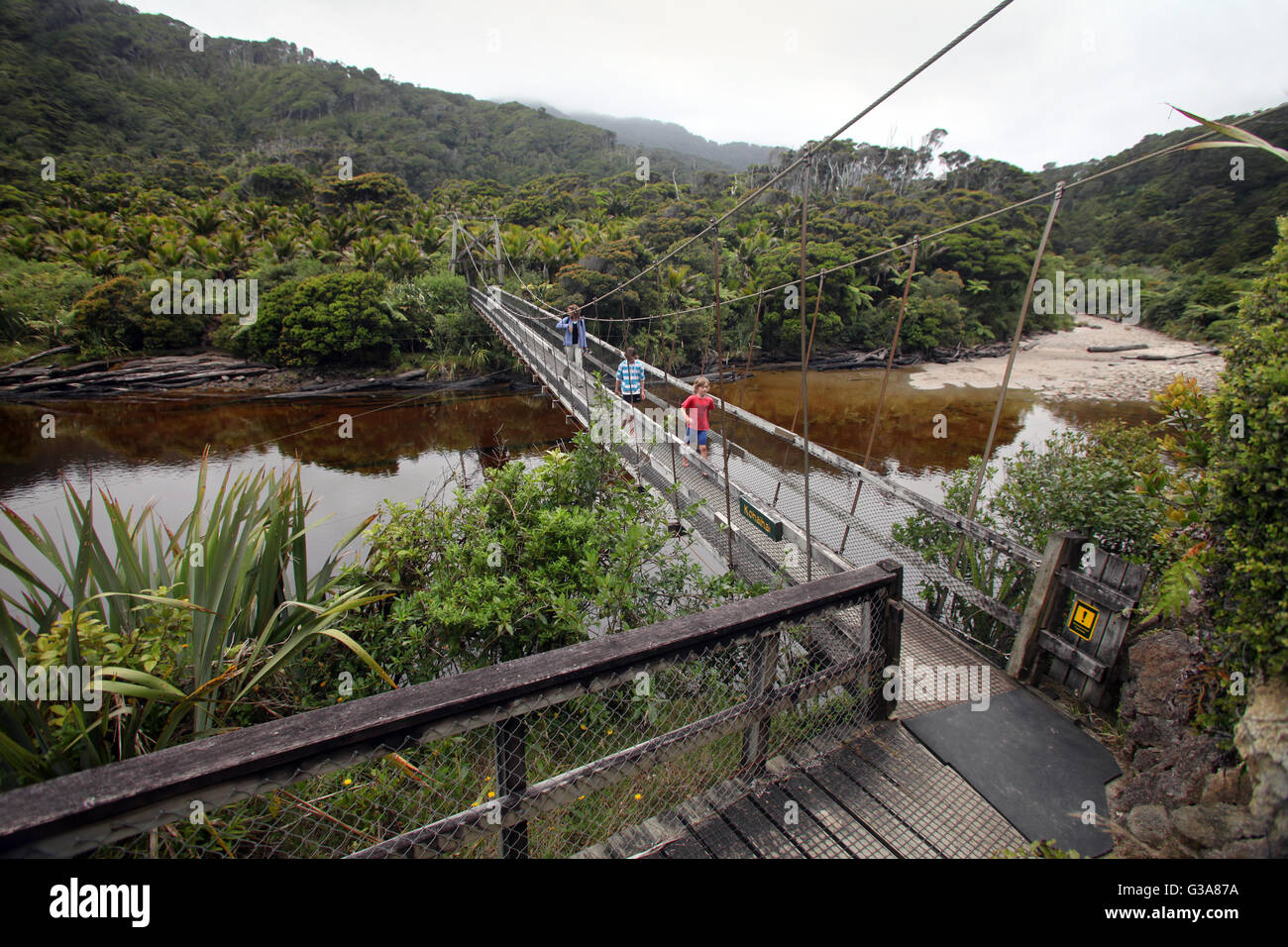 Family crossing suspension bridge hi-res stock photography and images ...