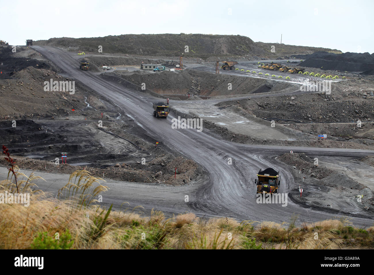 Huge trucks moving coal at Stockton Mine, near Westport Stock Photo - Alamy