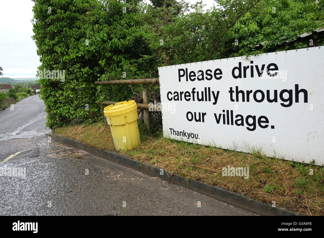 Please drive carefully through our village sign hi-res stock ...