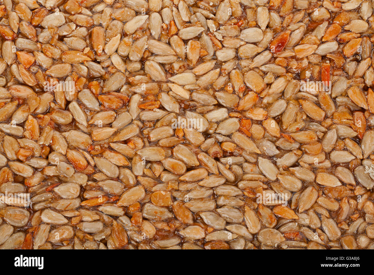 Sunflower seeds in sugar caramel closeup background Stock Photo - Alamy