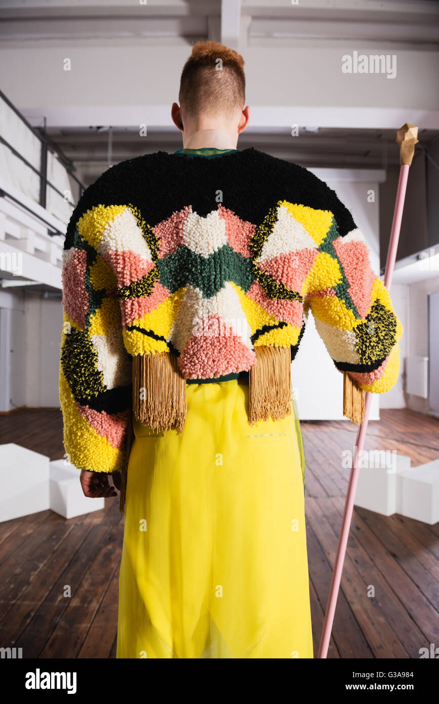 Extravagant male fashion show model from behind Stock Photo - Alamy