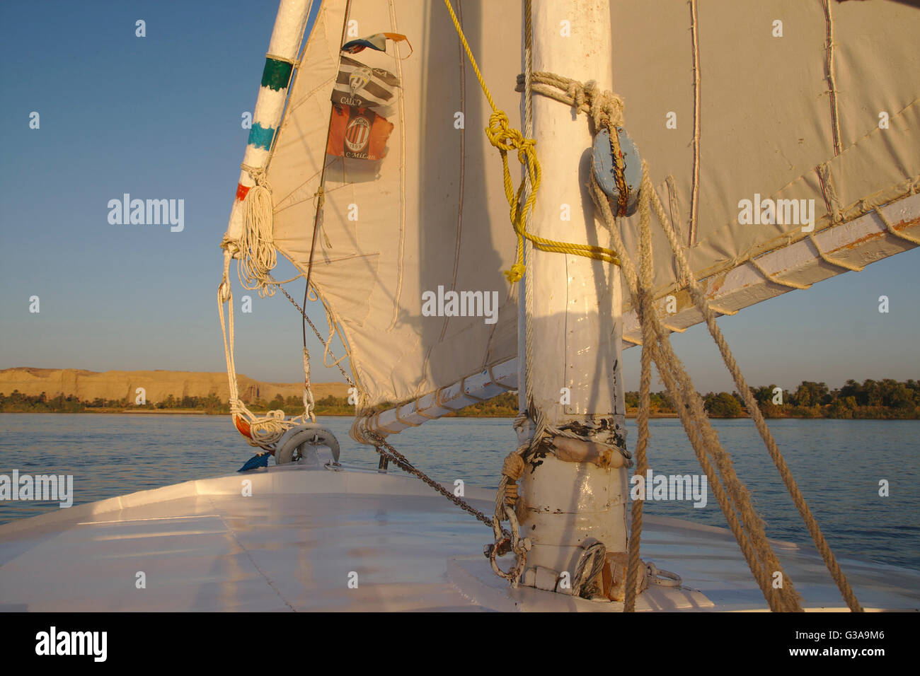 Felucca cruise on the river Nile in evening light, between Aswan and ...