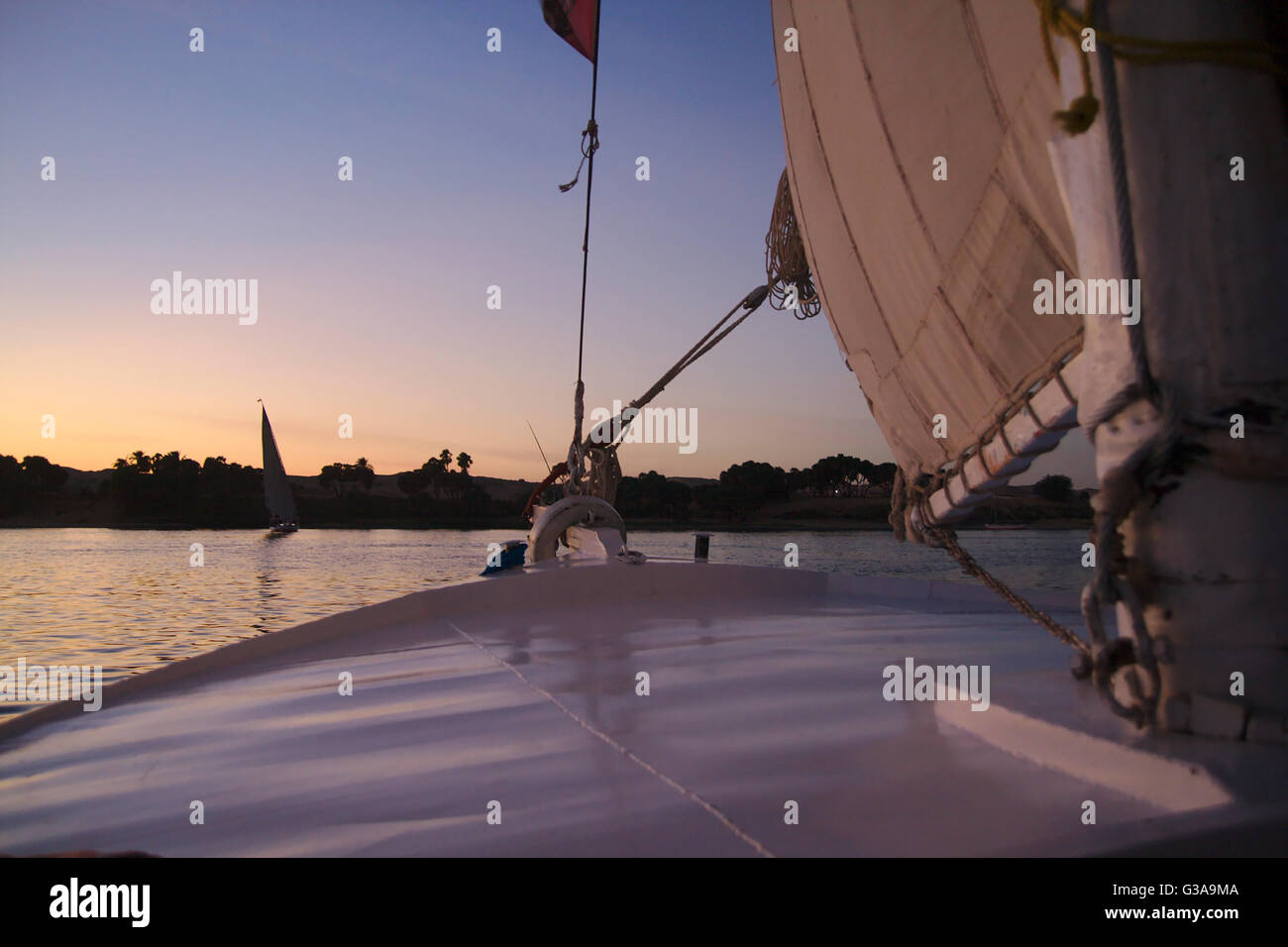 Felucca cruise on the river Nile at sunset, between Aswan and Kom Ombo ...