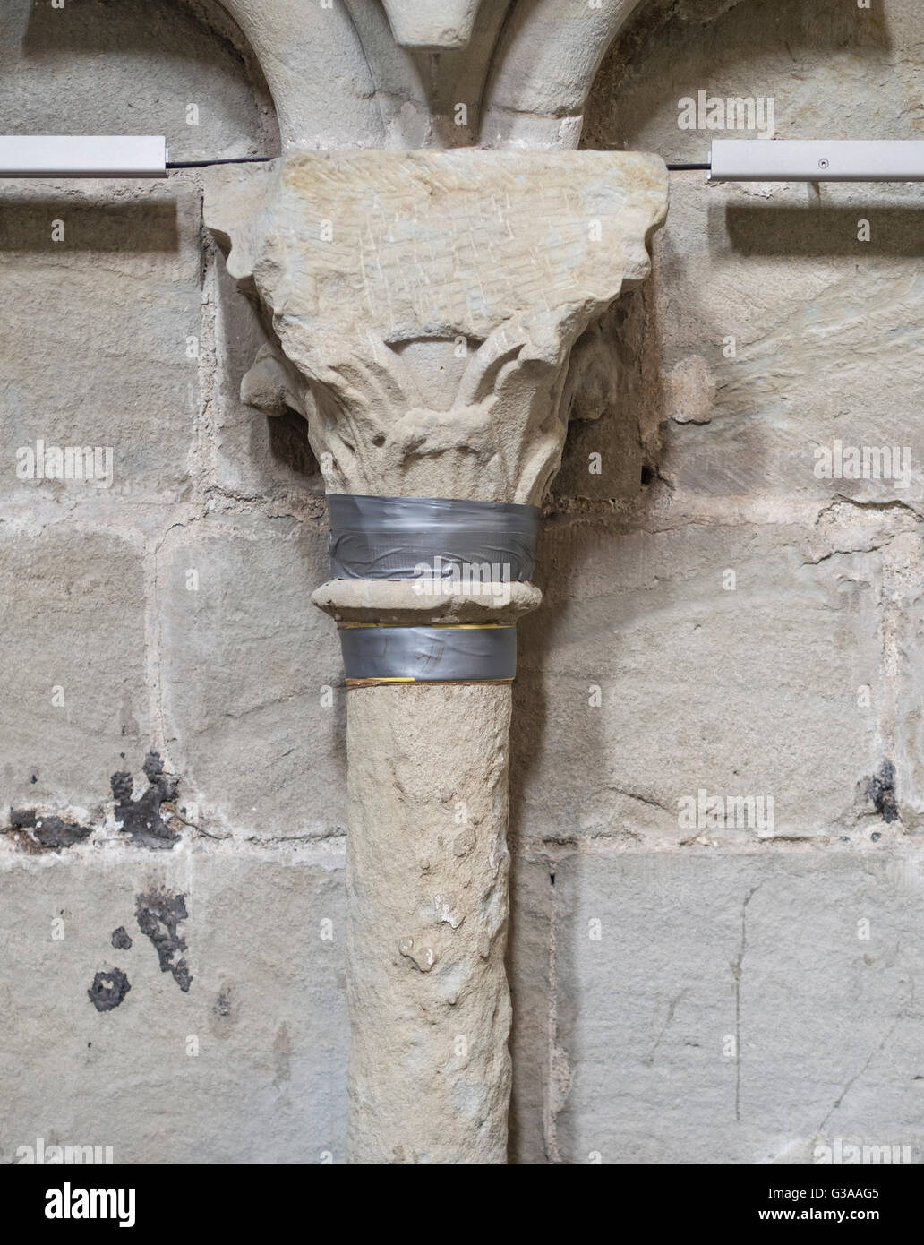 Historic Gothic style stone pillars with cracks and fissures ...